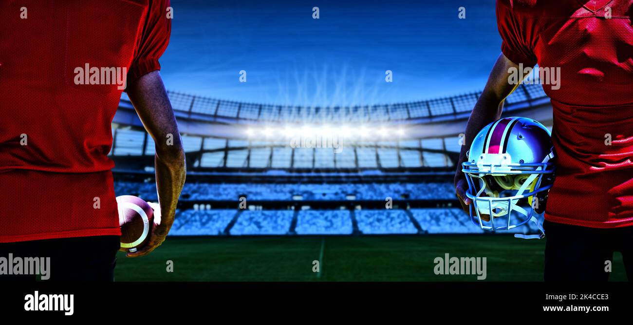 American Football Player against sports stadium at night Stock Photo ...