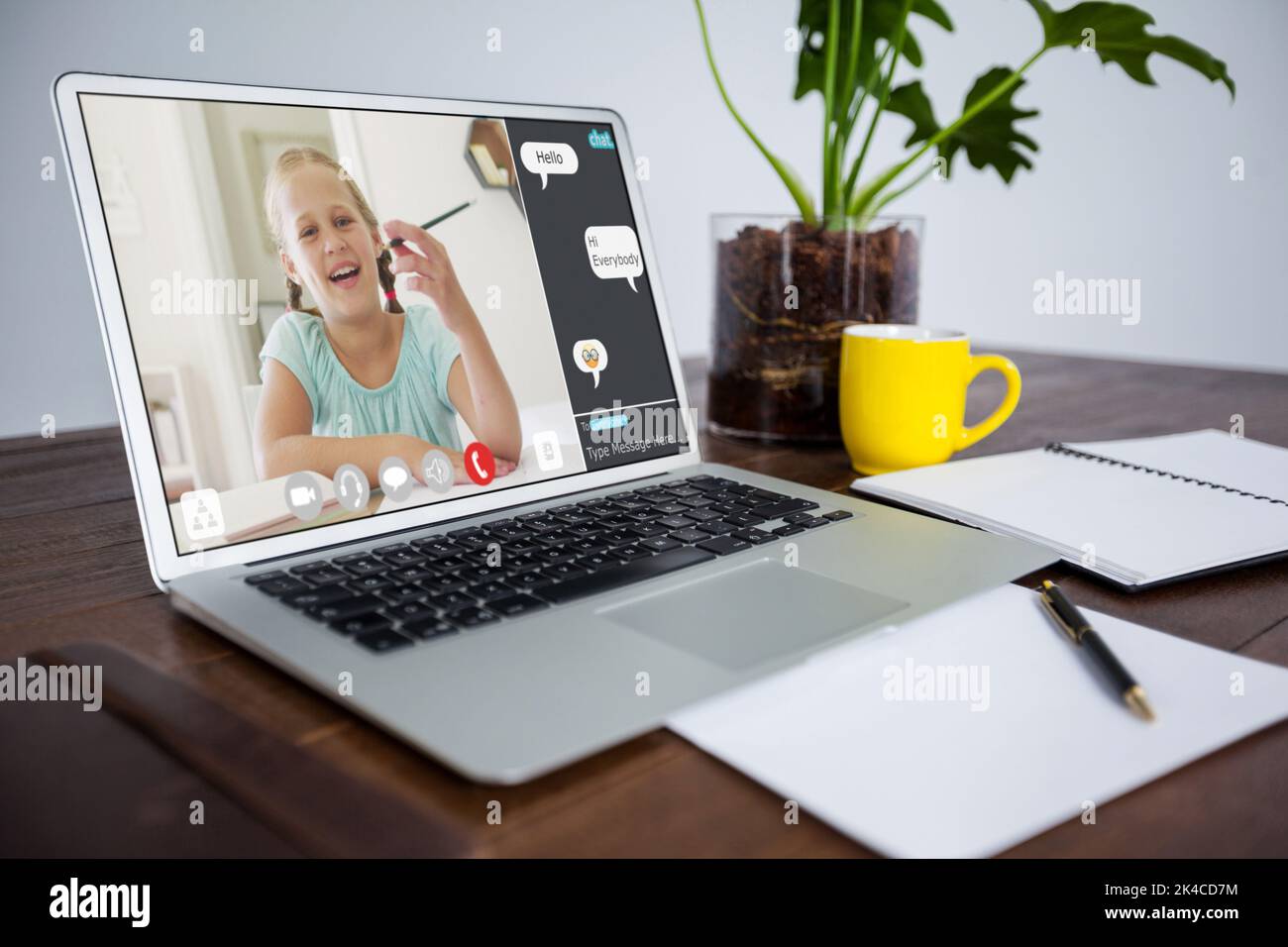 Smiling caucasian elementary school pupil during class on laptop screen ...