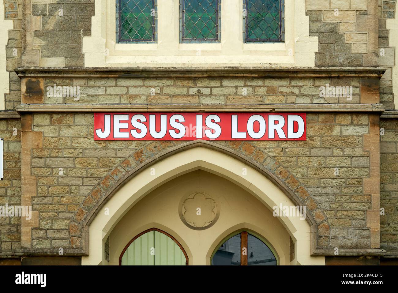 The text "Jesus is Lord" writing on the wall of an old, medieval church ...