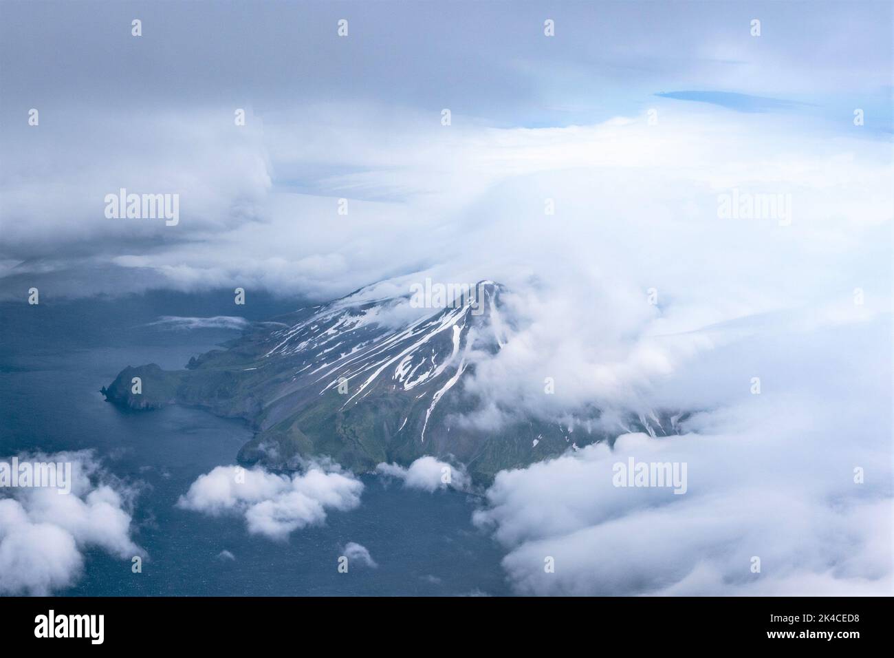 An aerial view of the Great Sitka Island with its stratovolcano behind ...