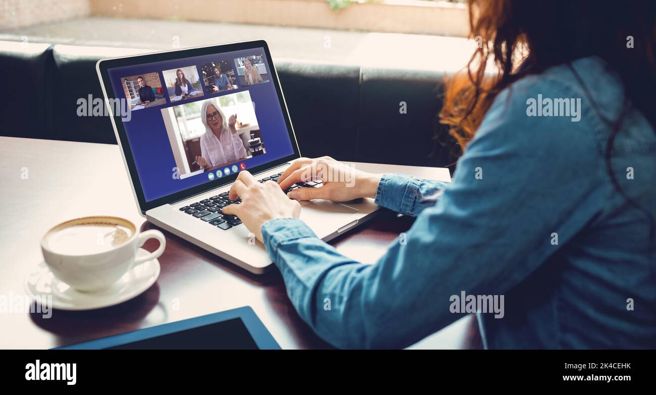 Caucasian businesswoman sitting at desk using laptop having video call ...
