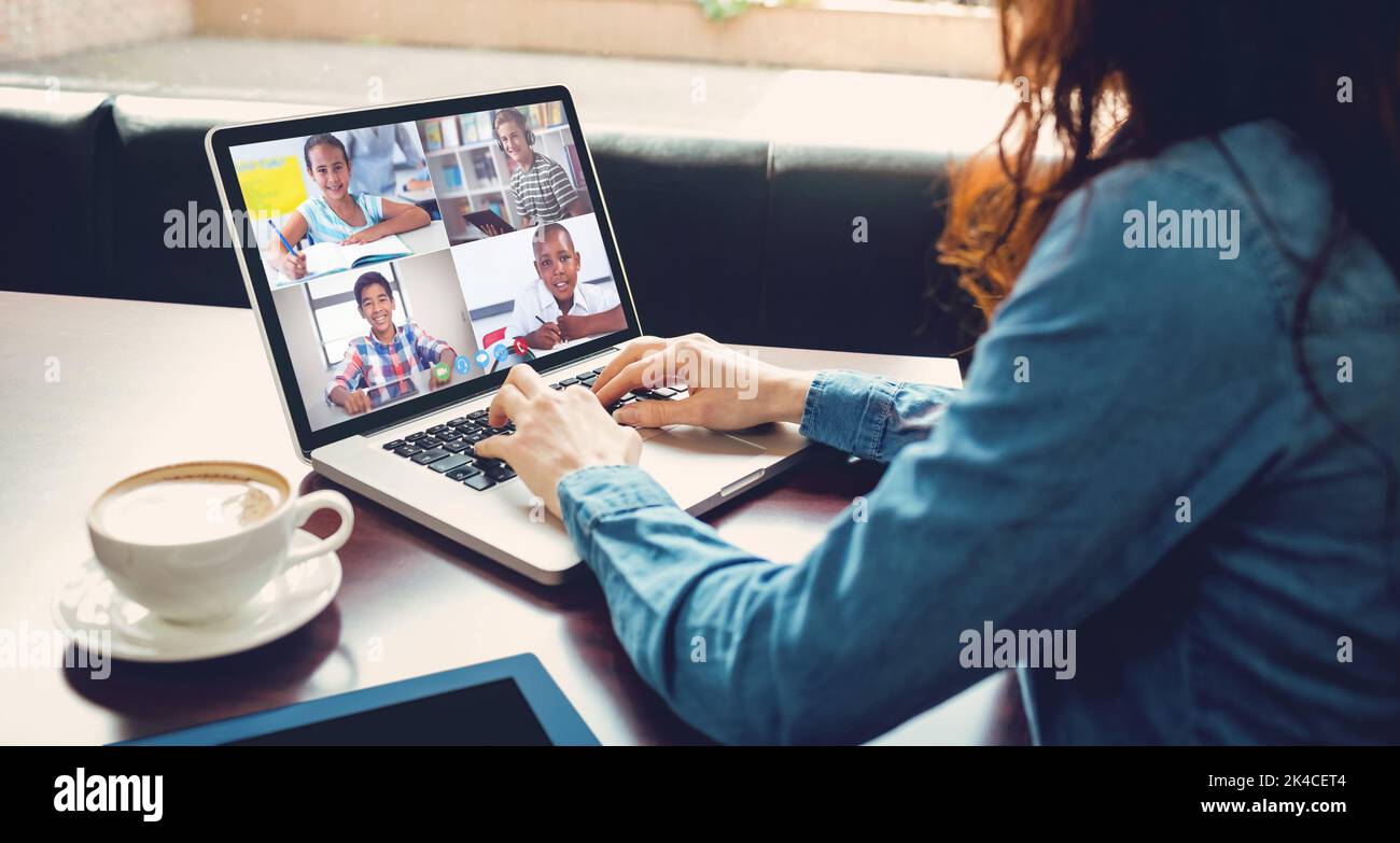 Caucasian female teacher having online lesson with pupils. at home in ...