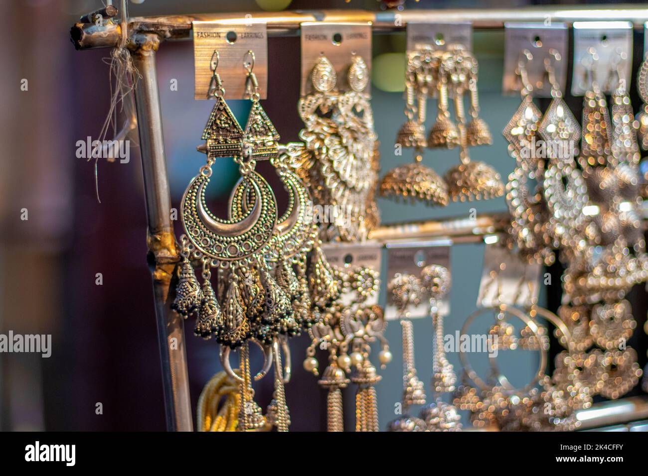 The traditional Indian, golden and silver jewelry in a street shop ...