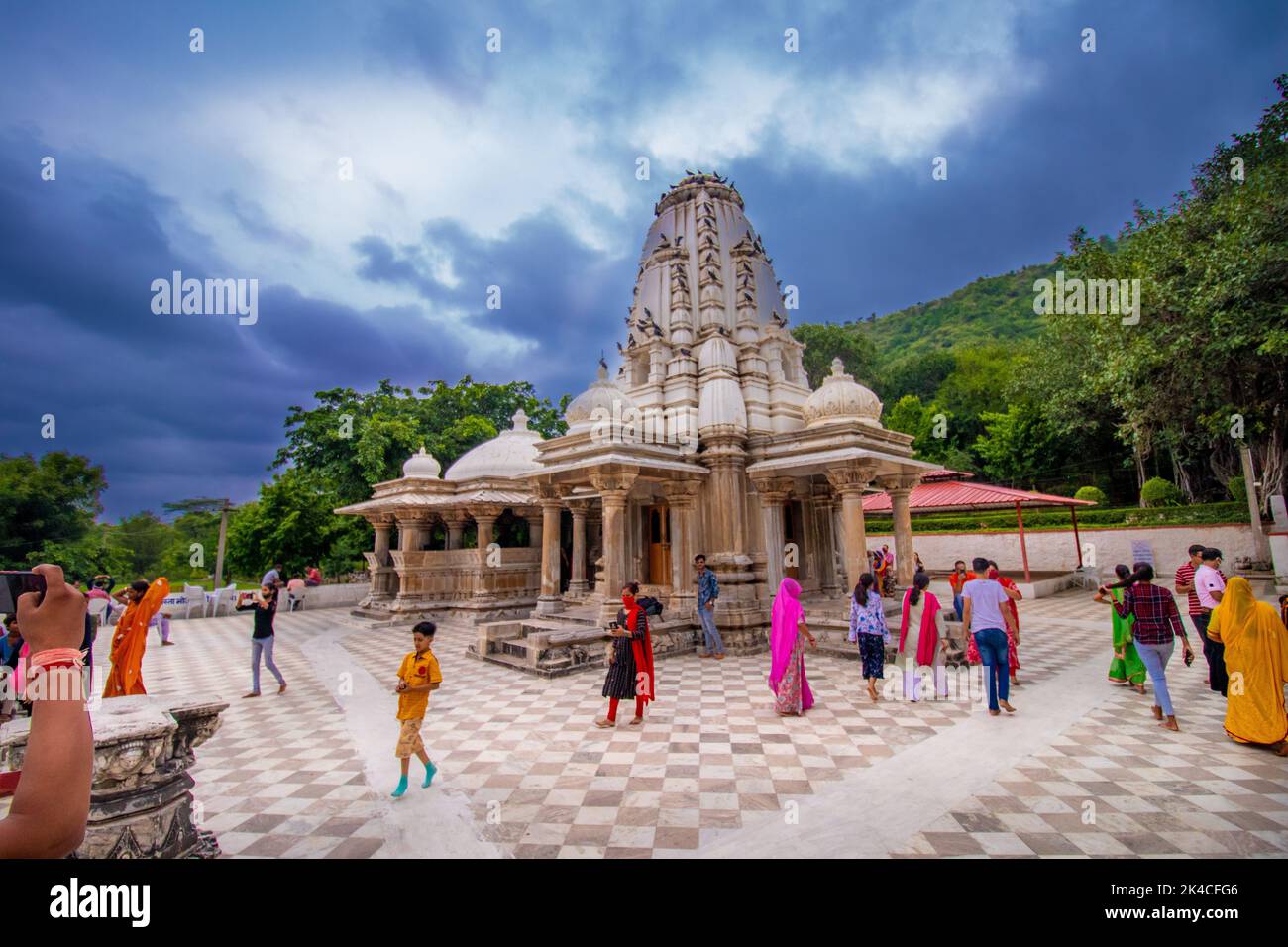 A crowd of people in front of an old Hindu temple, wide angle Stock ...