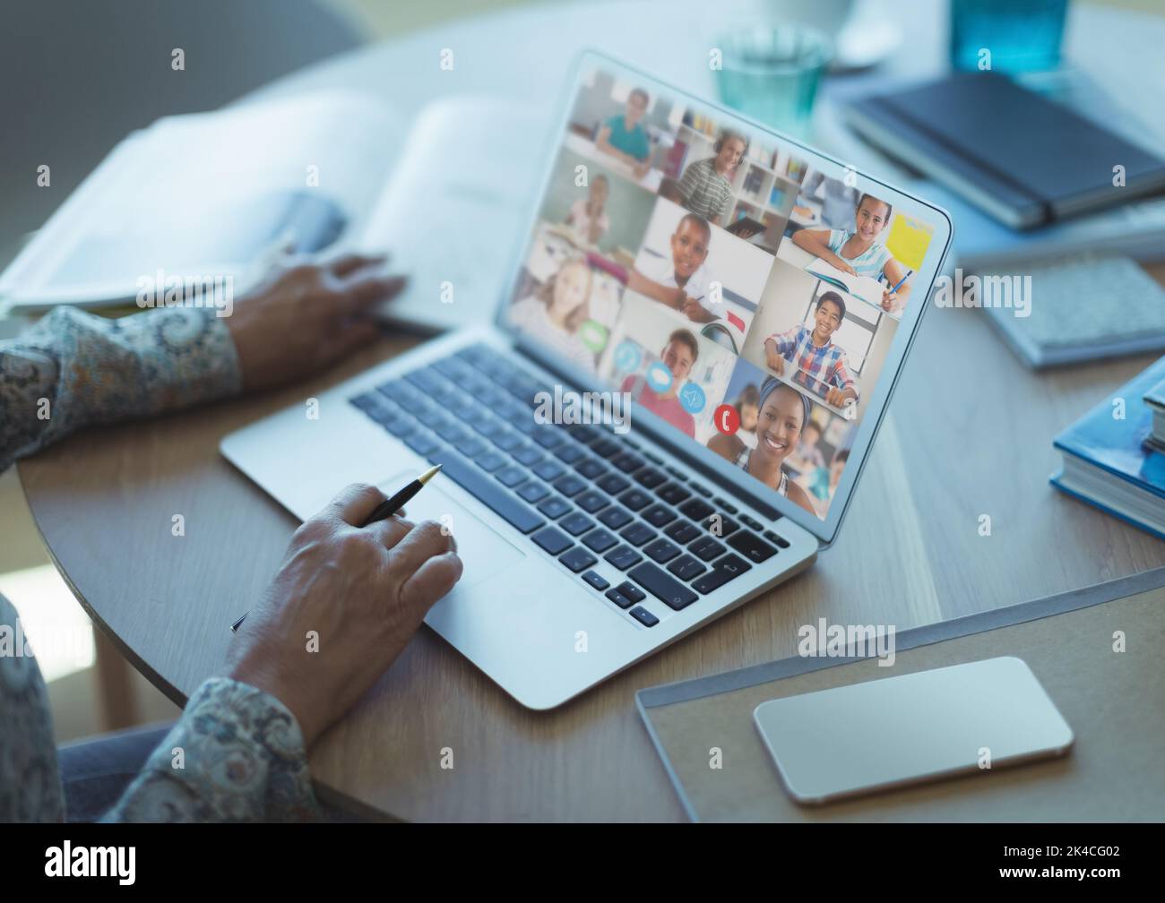 School children learning displayed on laptop screen during video call ...
