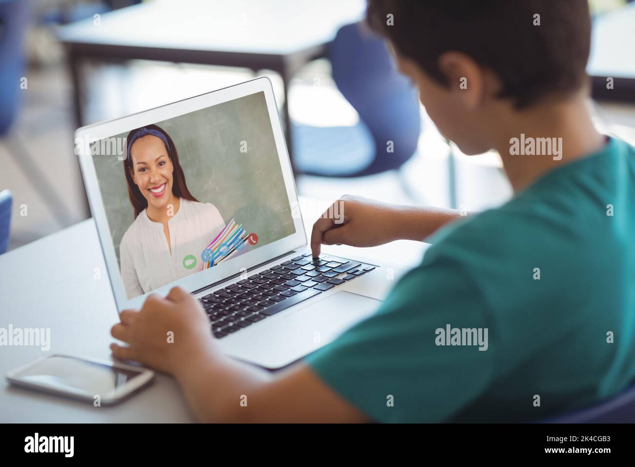 Male caucasian student having a video call with female teacher on ...