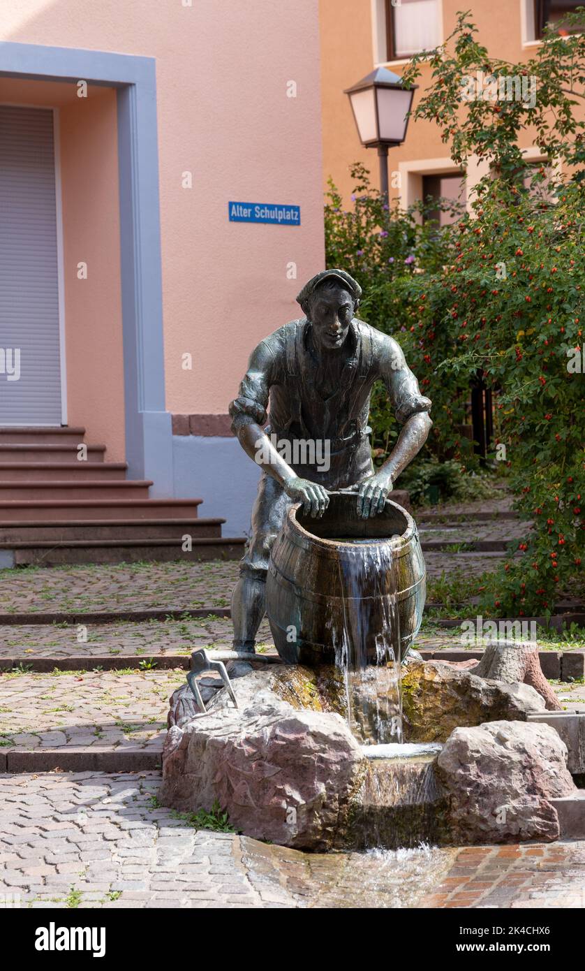 Fountain Man with an overflowing cask Stock Photo - Alamy