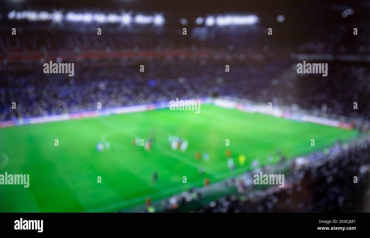 Soccer arena with blur on game day. Crowd watching football game at the ...