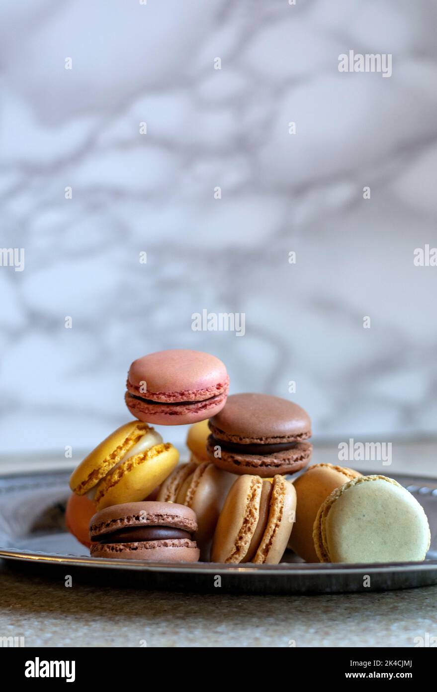 Elegant macarons against a marble background Stock Photo - Alamy