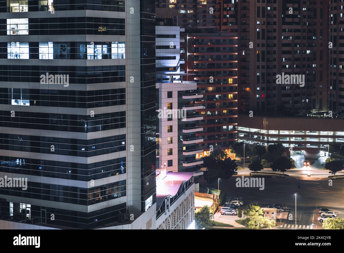 View of several huge dwelling houses, high-rises at night with ...