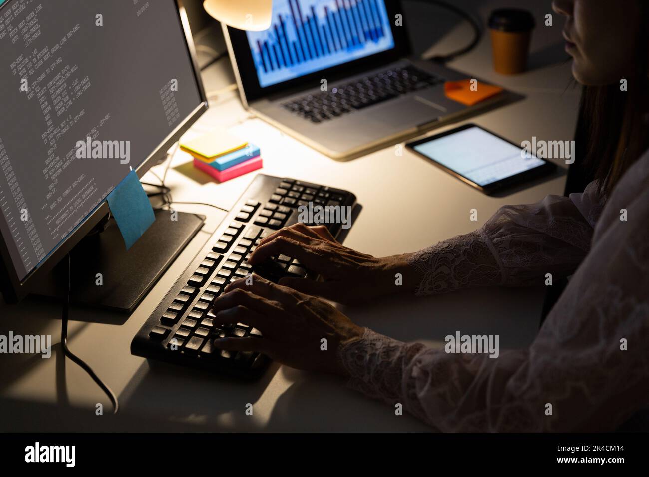 Hands of biracial female programmer sitting at desk, using computer ...