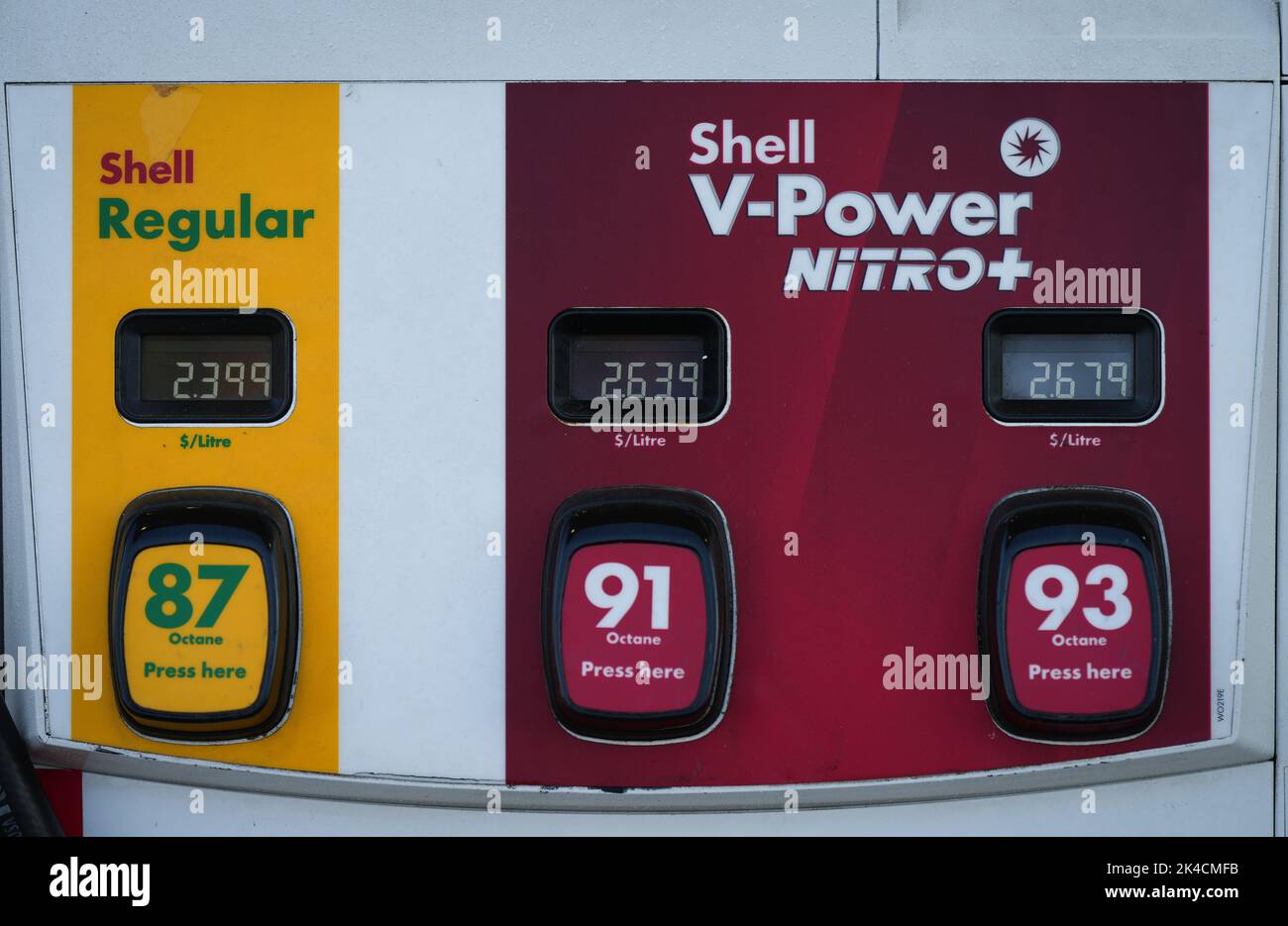 Prices for a litre of various grades of gasoline are displayed on a gas ...