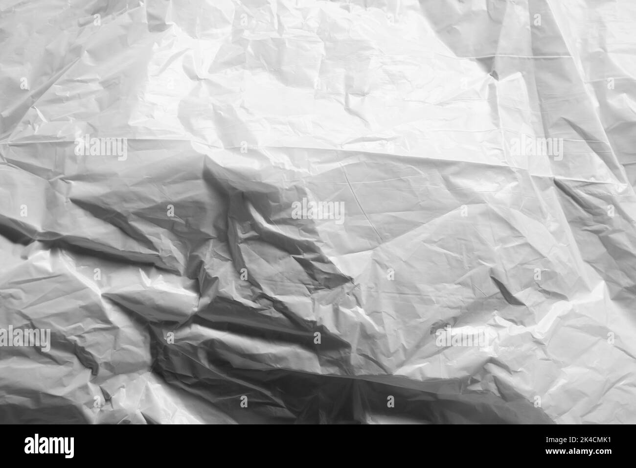 Reflecting light and shadow on creases and folds in scrunched white ...