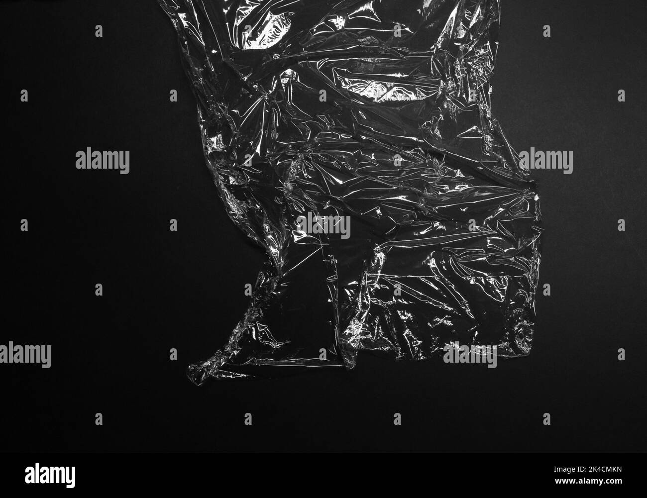 Reflecting light and shadow on creases and folds in scrunched clear ...