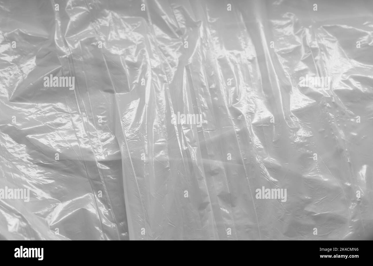 Reflecting light and shadow on creases and folds in scrunched white ...