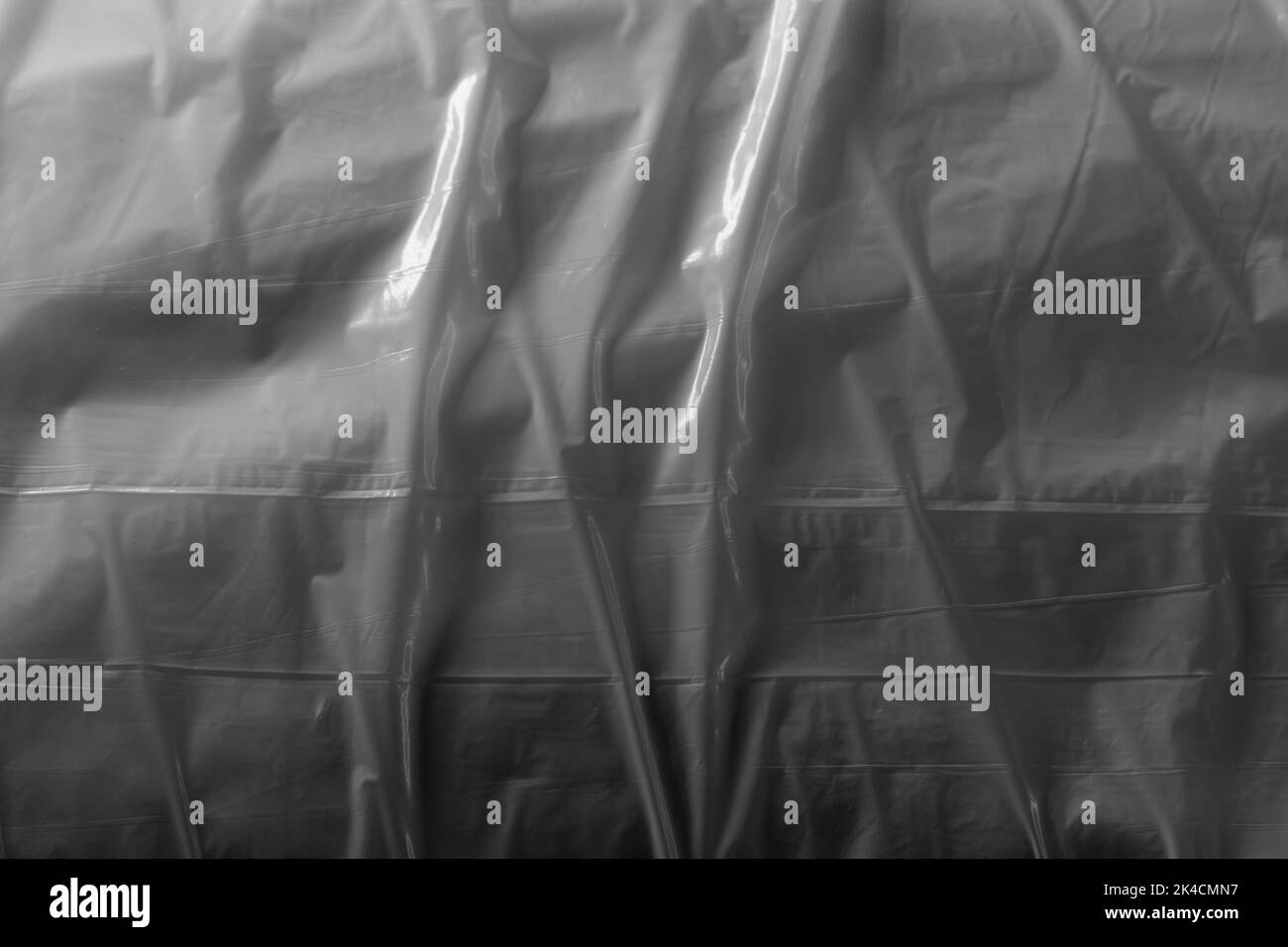 Reflecting light and shadow on creases and folds in plastic sheeting ...