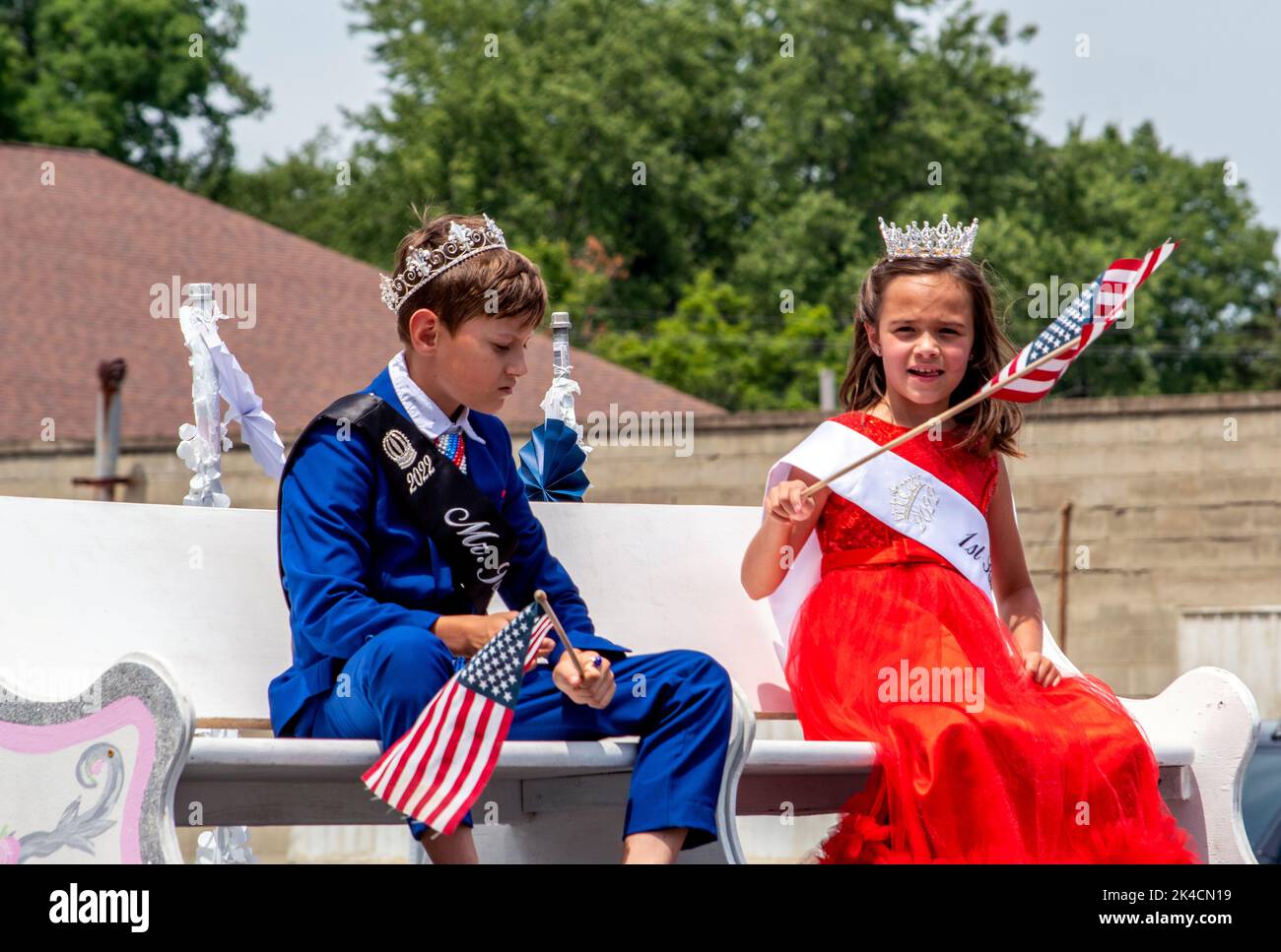 Eau Claire MI USA July 4 2022; a pair of cute, young pageant kids ride ...