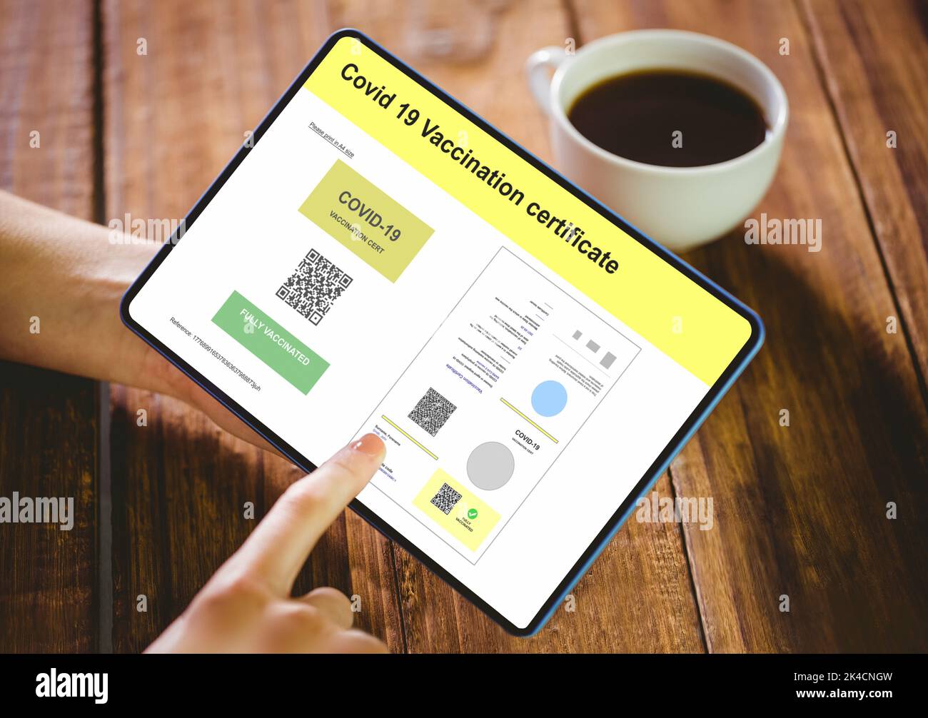 Woman using her tablet pc on wooden table Stock Photo - Alamy