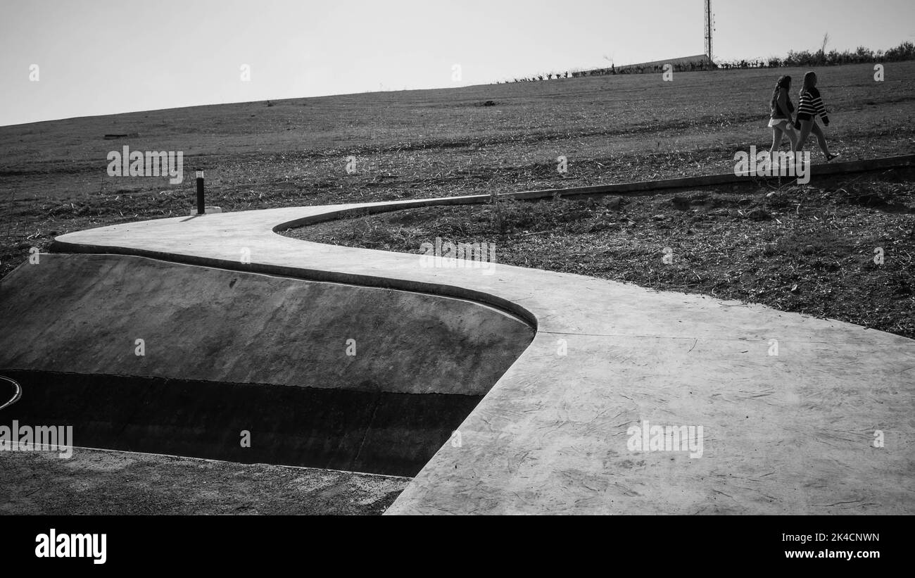 Women walking together outdoors Black and White Stock Photos & Images ...