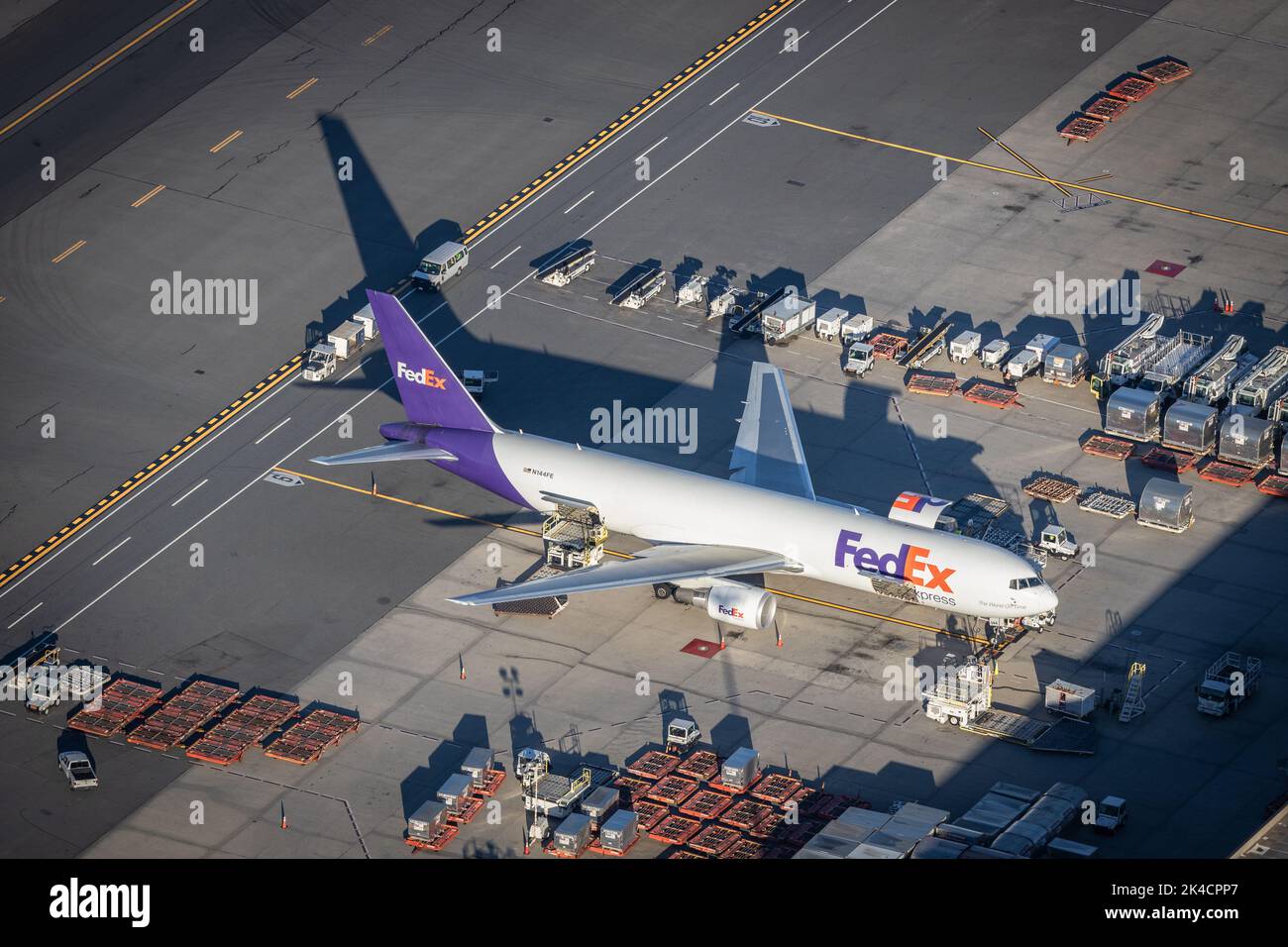 An aerial side shot a FedEx cargo plane being loaded up at Bostons ...