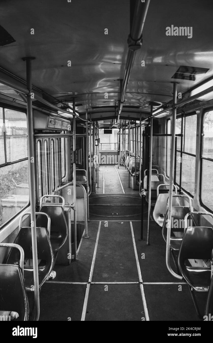 A vertical grayscale of the inside of an empty bus Stock Photo - Alamy