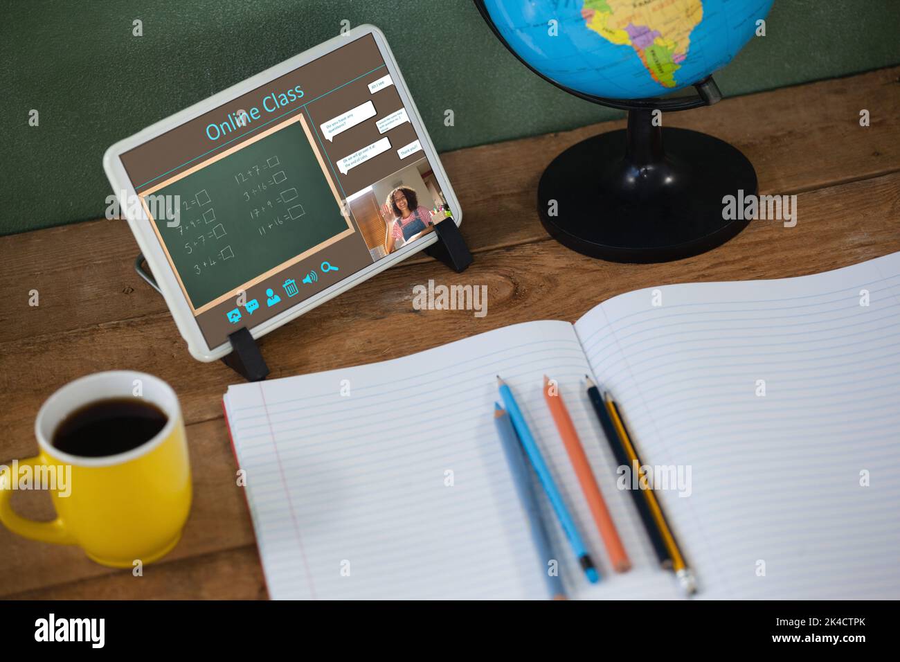 Smiling biracial female teacher during class on tablet screen ...