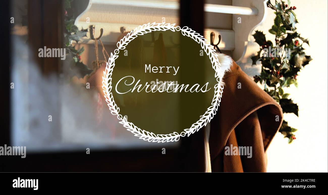 Composition of christmas season's greetings over christmas decoration ...