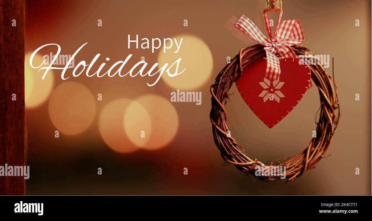 Composition of christmas season's greetings over christmas decoration ...