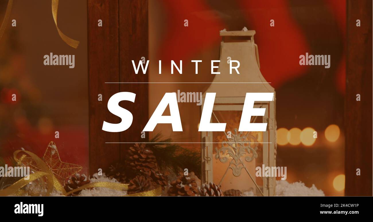 Composition of winter sale text over christmas window decoration in ...