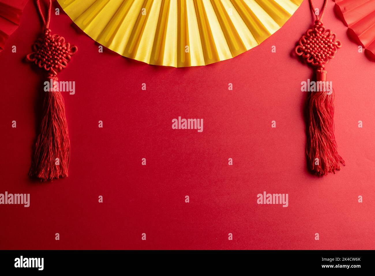 Composition of traditional chinese fans and decorations on red ...