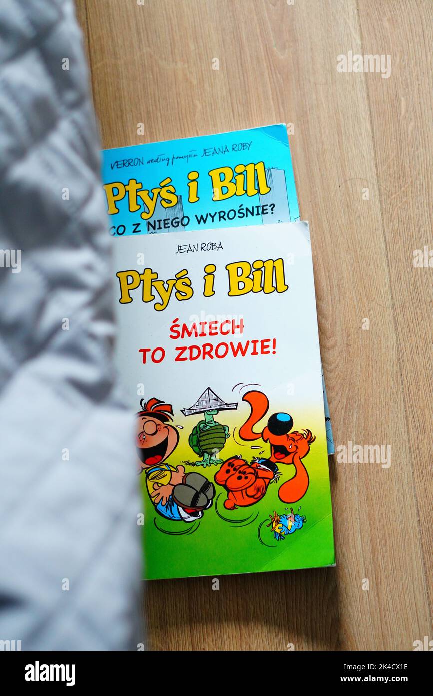 A vertical shot of two Polish comic books called Ptys I Bill laying on ...