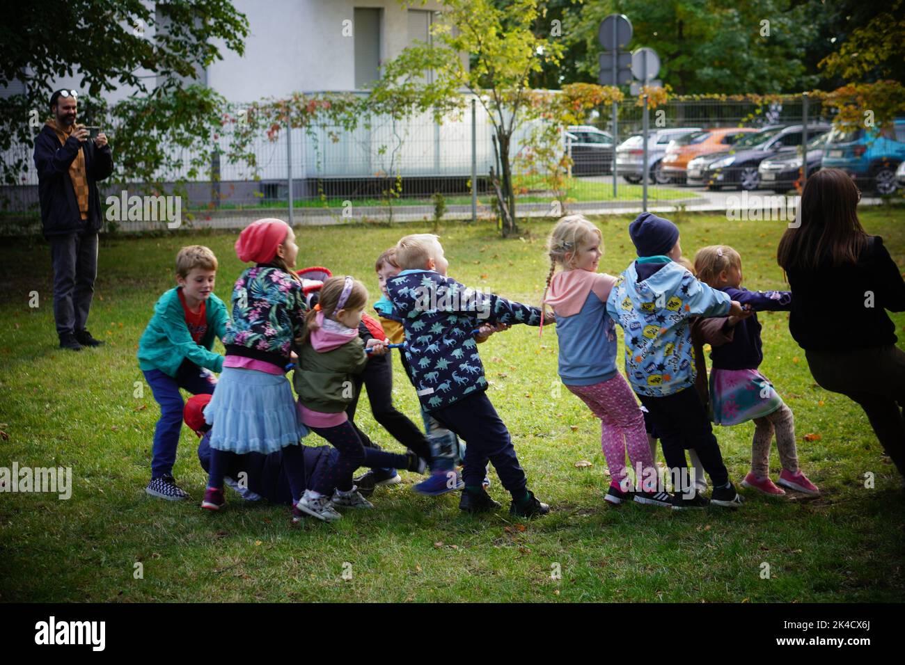 A group of children having fun during a game at a Kindergarten event ...