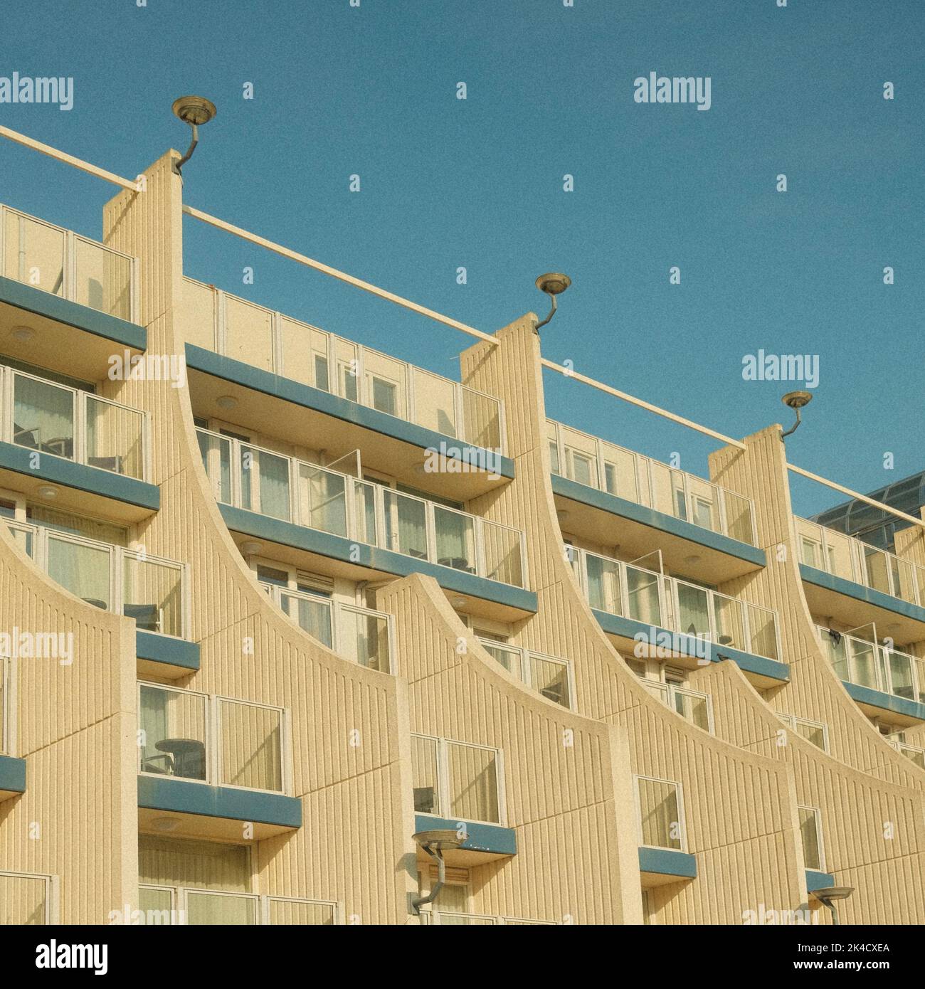 A beautiful beige building facade in a sunny weather Stock Photo - Alamy