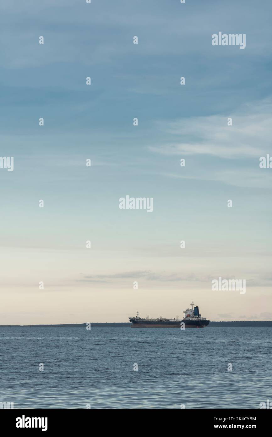 A vertical shot of a cargo ship at the bay of Matanzas, Cuba Stock ...