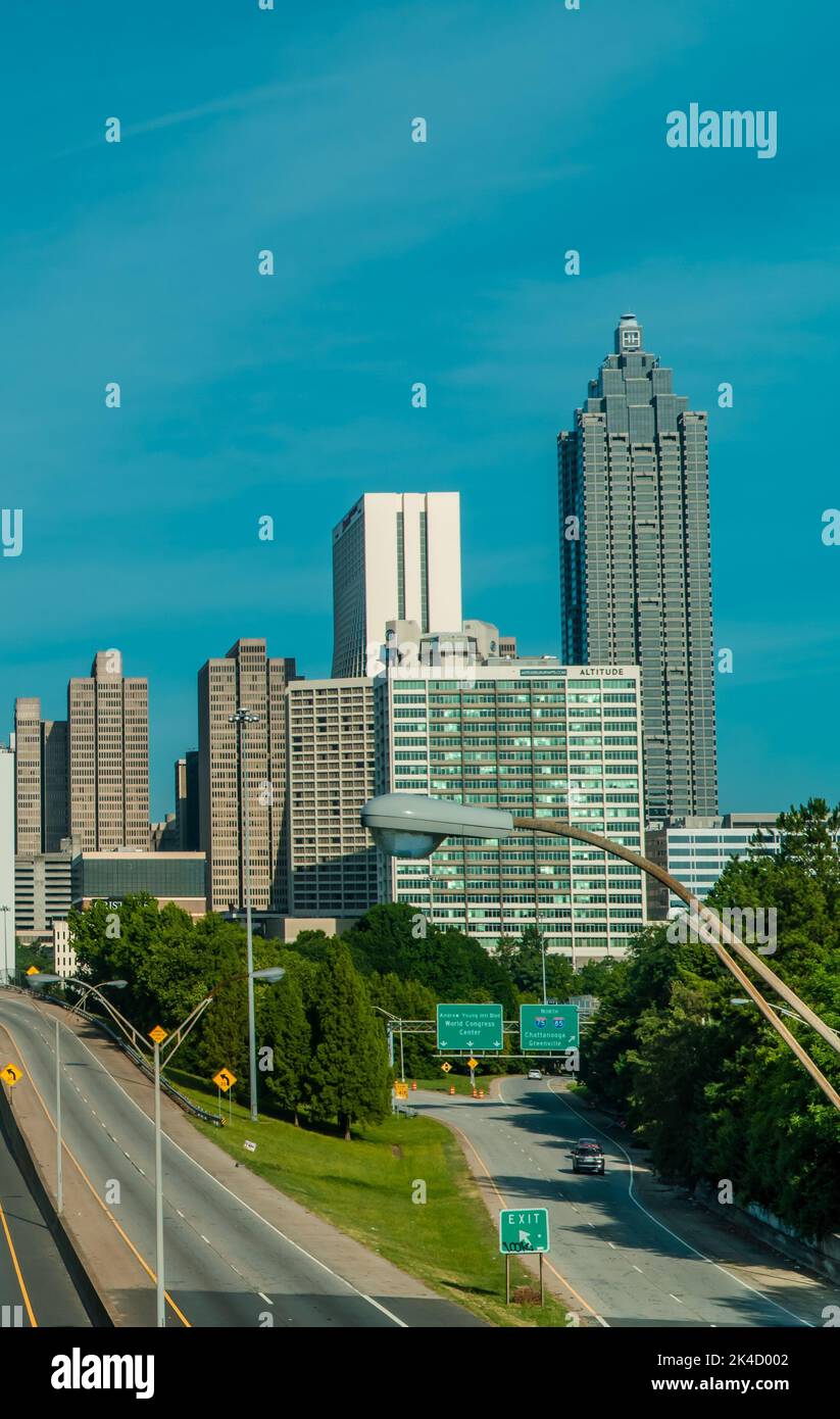 A vertical shot of downtown Atlanta skyscrapers under blue sky, Atlanta ...