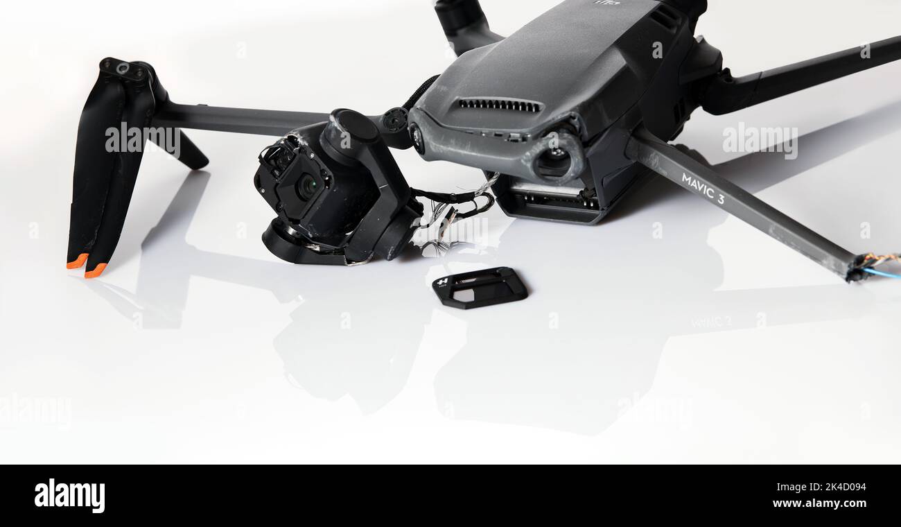 Drone DJI Mavic 3 after crashed on a white background. Drone after ...