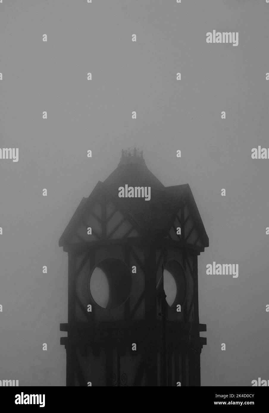 A vertical grayscale of the top of a temple Stock Photo - Alamy
