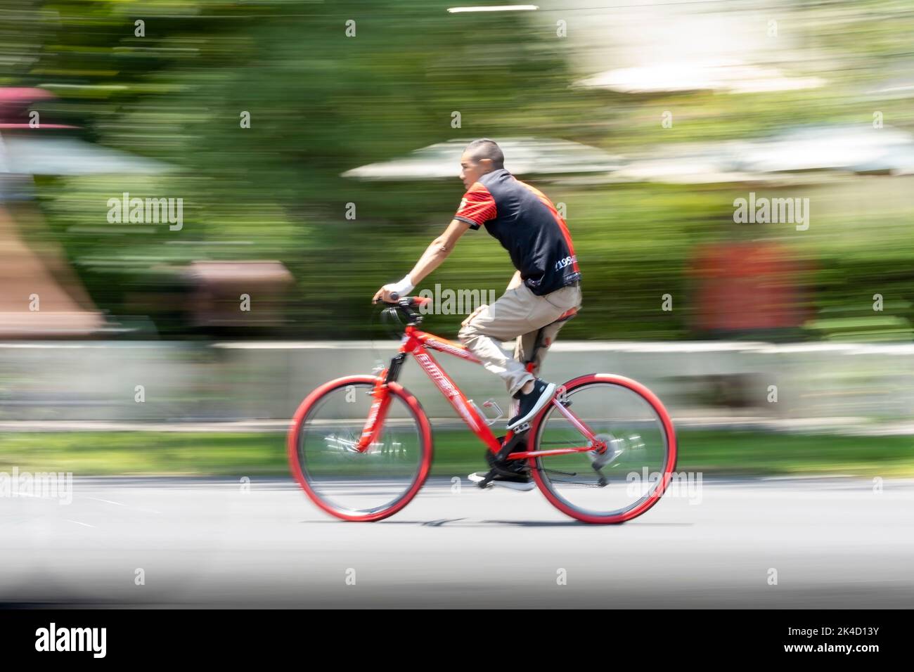 young man on bicycle, riding a sunday, photo with swept background and ...