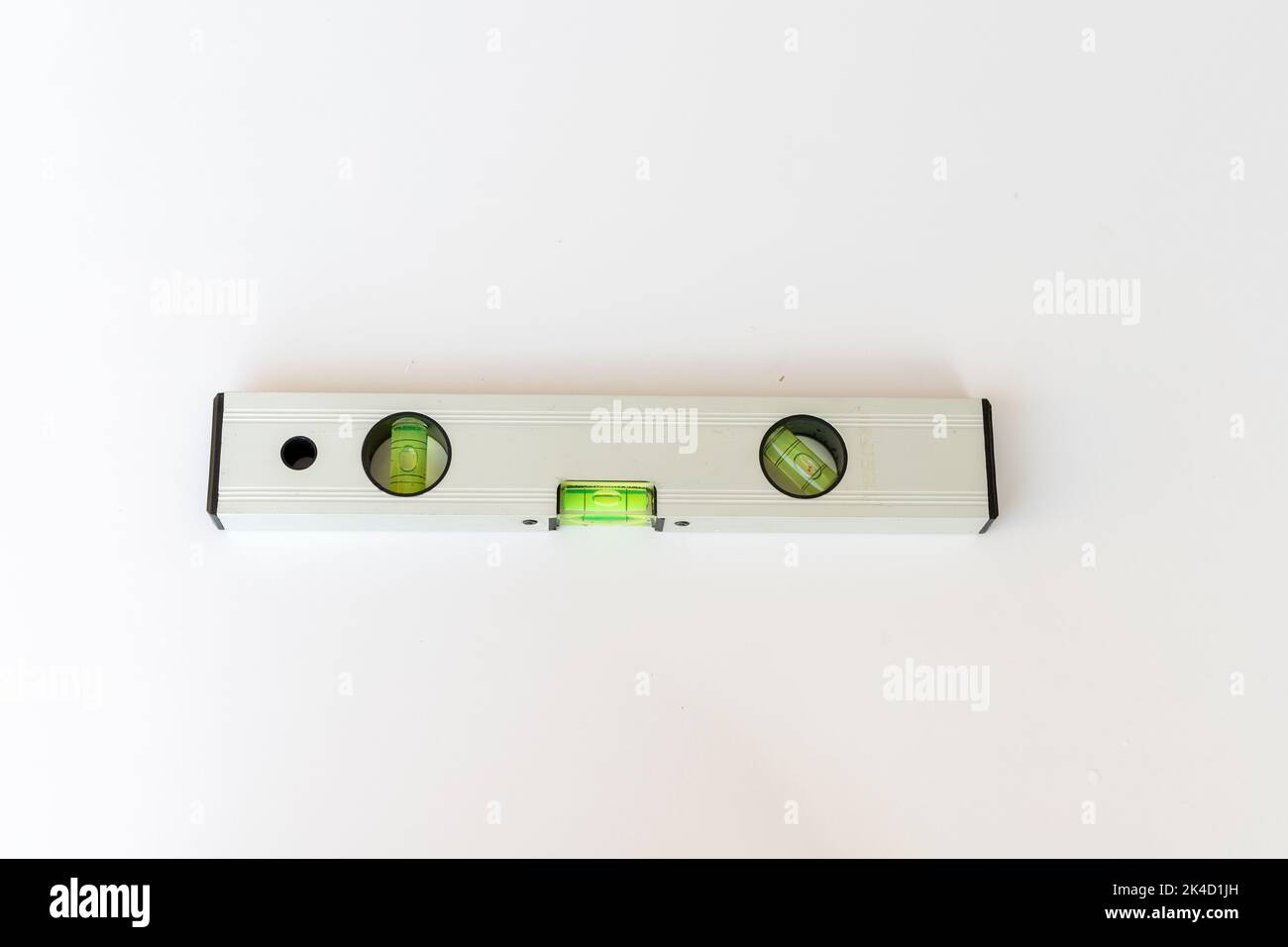 spirit level tool on white isolated background Stock Photo - Alamy