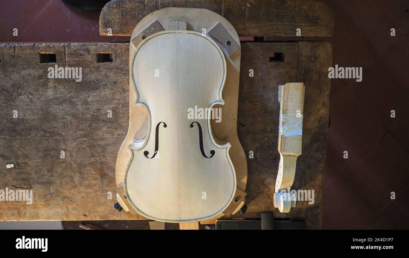 Violin blanks, master violin maker on maker desk Stock Photo - Alamy