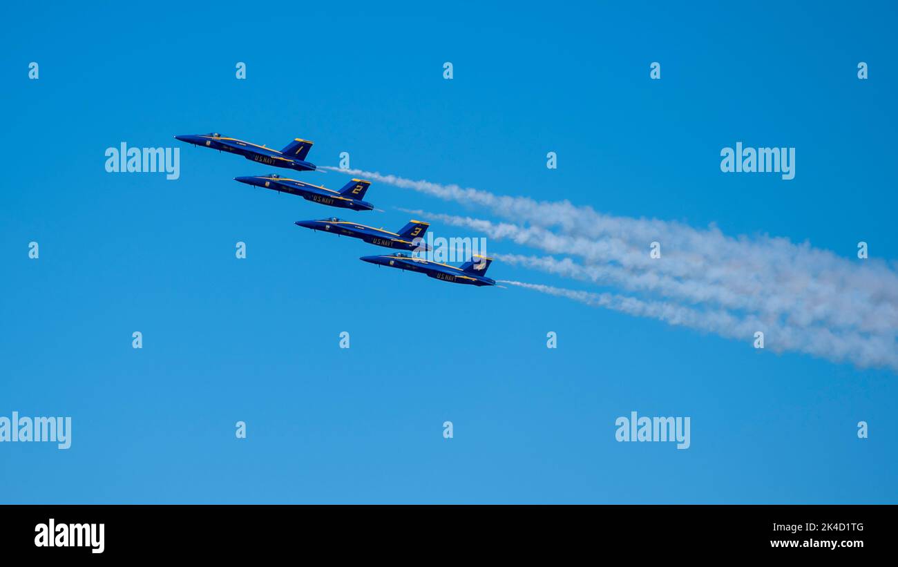 A formation of F-18 Super Hornet Blue Angel aircrafts in flight in a ...