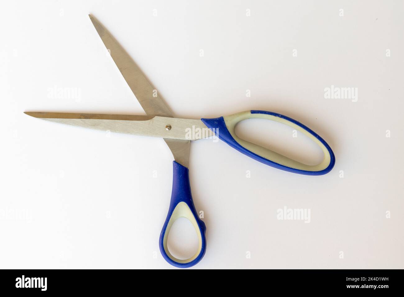 Metal scissors open on isolated white background Stock Photo - Alamy