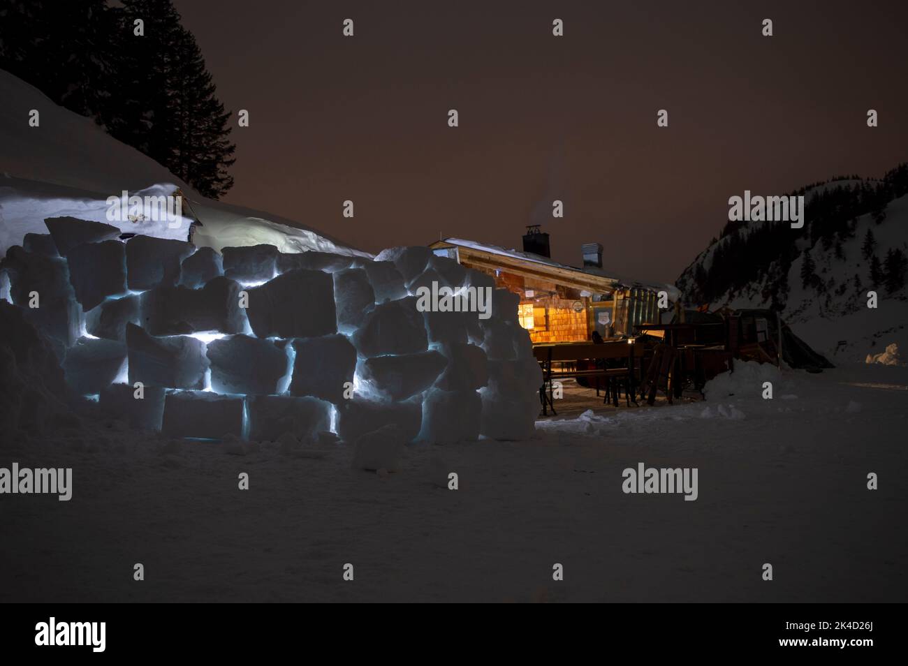 An ice wall and a wooden house at winter in the night Stock Photo - Alamy