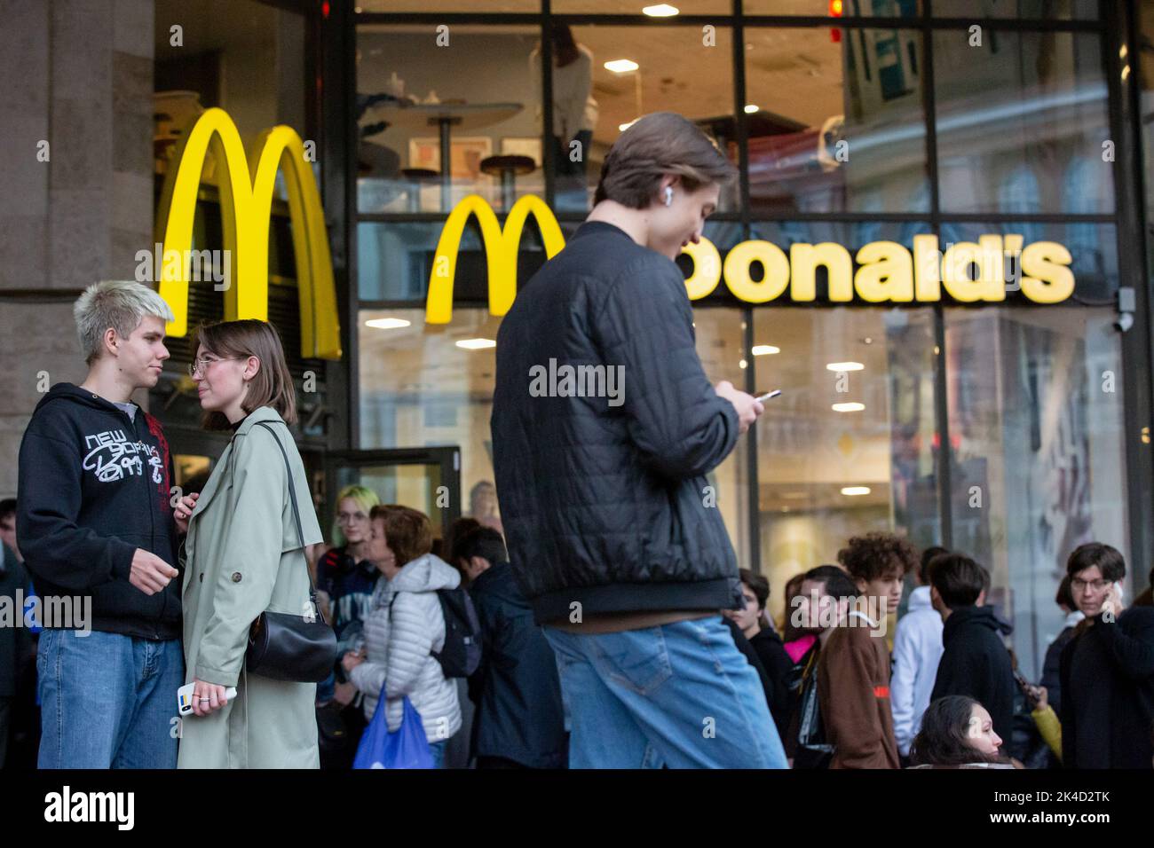 People waiting in line to pick up orders at the McDonald's restaurant ...