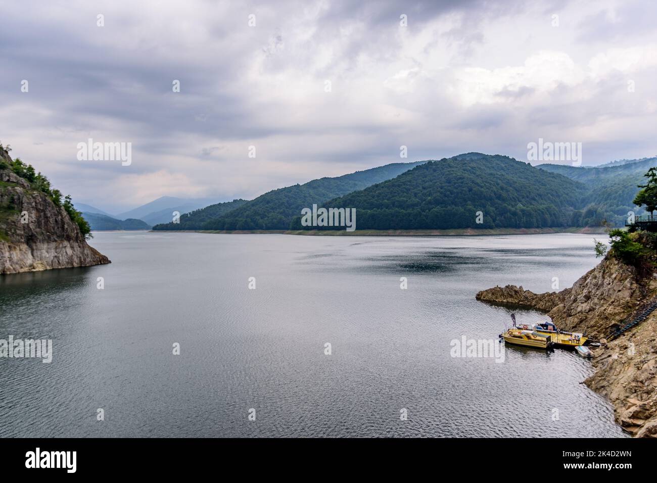 A scenic view of Vidraru Dam with greeneries around Stock Photo - Alamy