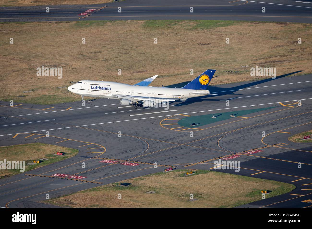 An airplane of Lufthansa Boeing 747 jet taking off from Logan International Airport in Boston ...