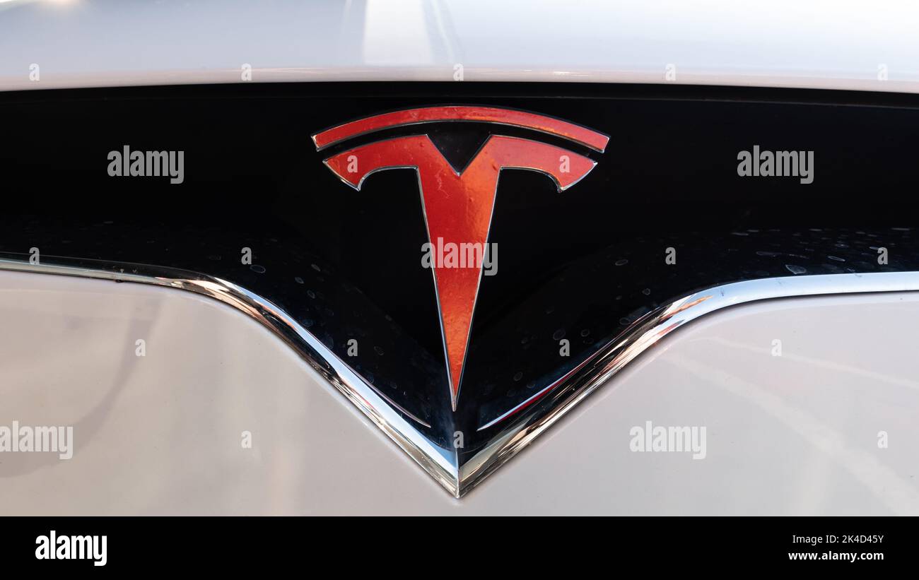 A closeup of the Tesla logo on a car Stock Photo - Alamy