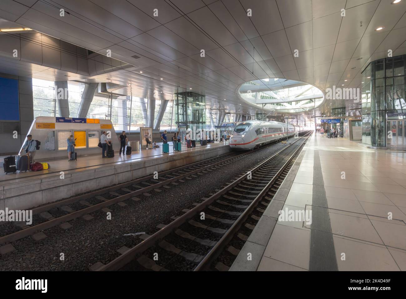 A high-speed ICE train at the airport's long-distance station with ...