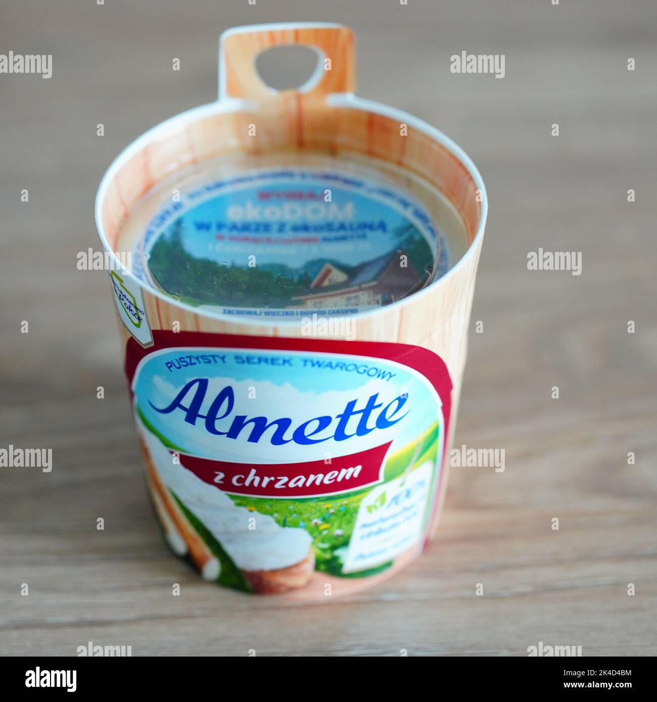 A closeup of Zott Almette brand cream cheese on a wooden table Stock ...