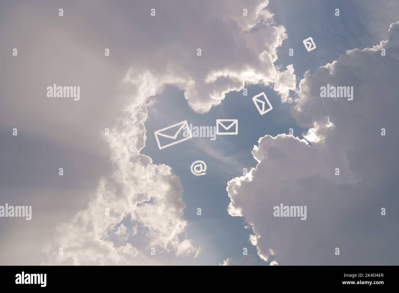A sky with clouds with message and mail symbols in the middle Stock ...